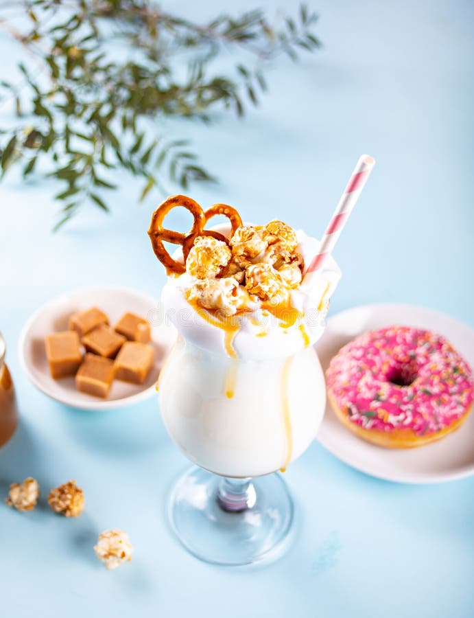 Milkshake with Caramel Syrup, Popcorn and Brezel Waffles Stock Photo ...