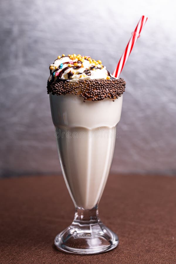 Milkshake with Multicolored Sprinkles and a Straw Stock Image - Image ...