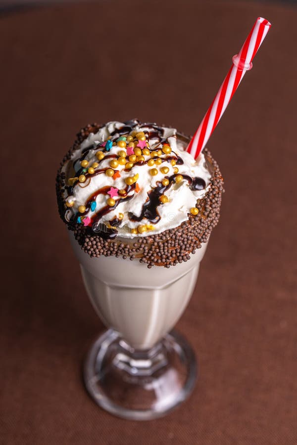 Milkshake with Multicolored Sprinkles and a Straw Stock Image - Image ...