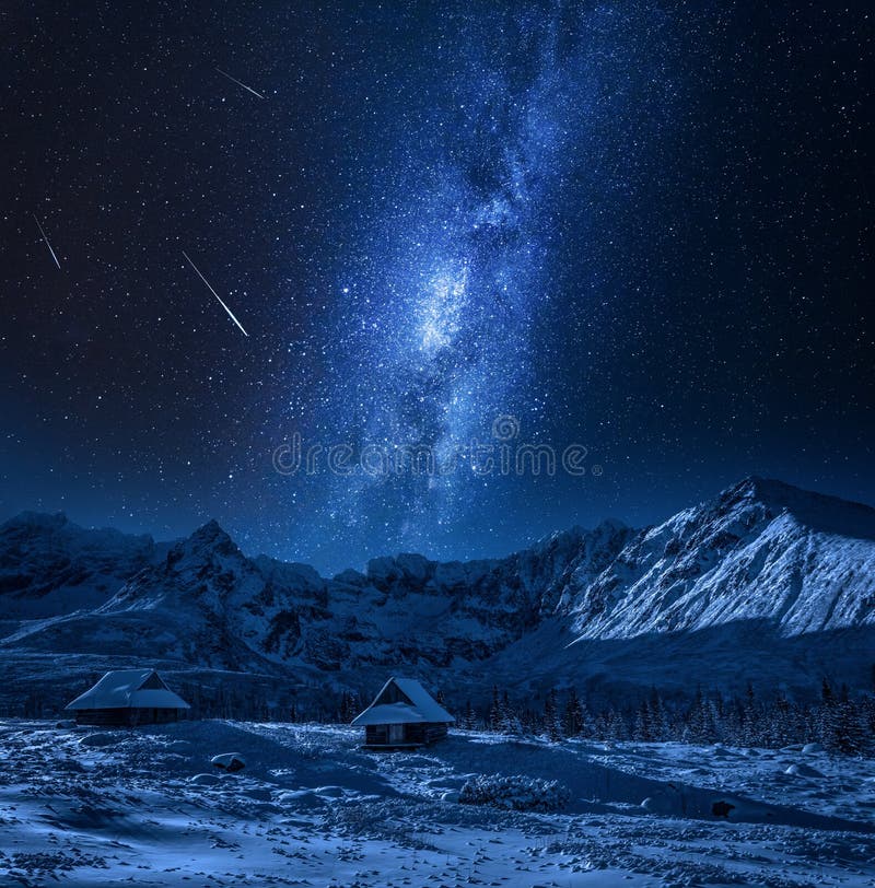 Milky Way and Falling Stars Over Cold Mountains in Winter Stock Photo ...