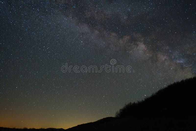 Milky Way Galaxy and a Piece of Hill with Trees Stock Photo - Image of ...