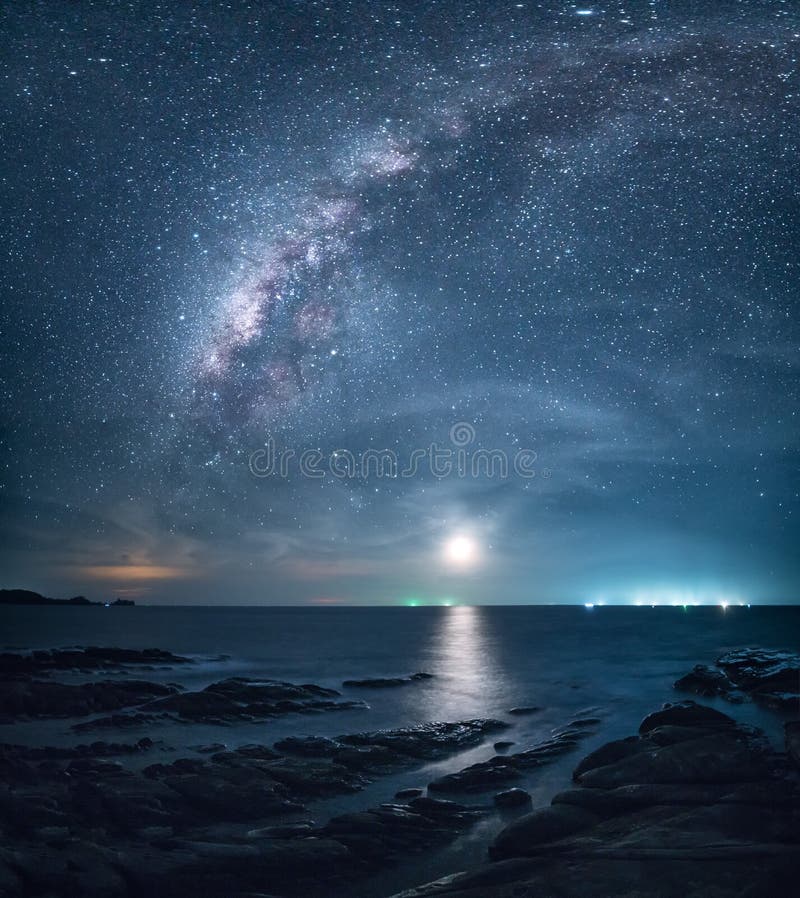 The Milky Way and Moon Beyond the Sea in Sabah, Malaysia Stock Photo ...