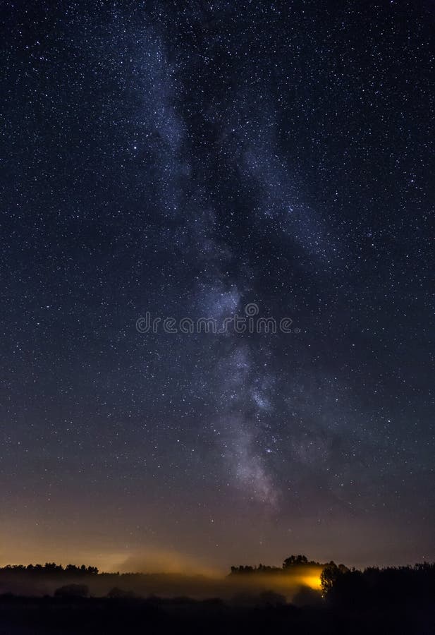 The Milky Way and Stars with a Farm Lights and a Treeline in the ...