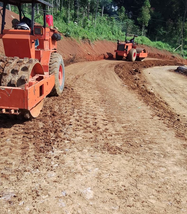 The Mill Car is Leveling the Red Soil for Road Construction Stock Image ...
