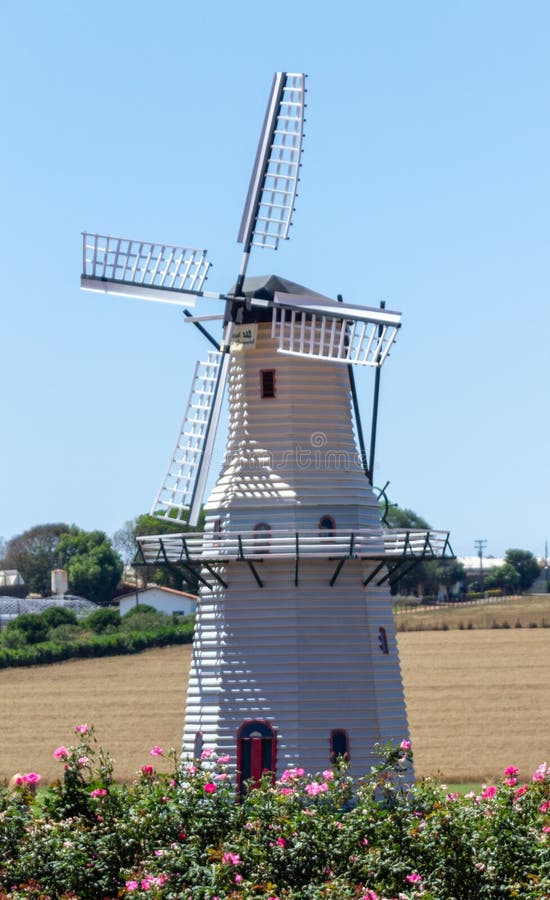 White Mill in with a Garden with Flowers Stock Photo - Image of ...