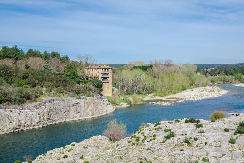 Mill on the River with a Cloudy Blue Sky Stock Image - Image of hydro ...