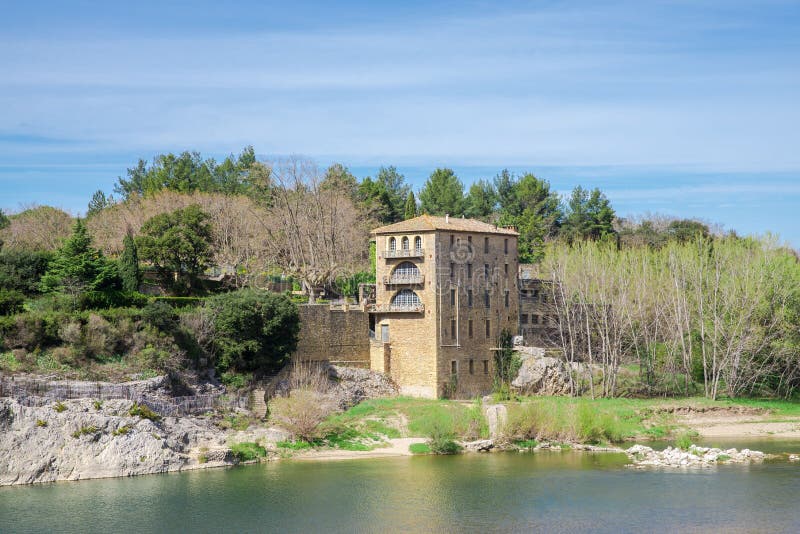 Mill on the River with a Cloudy Blue Sky Stock Photo - Image of gard ...