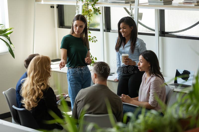 Millennial Business Team Meeting And Talking Discussing Work Project