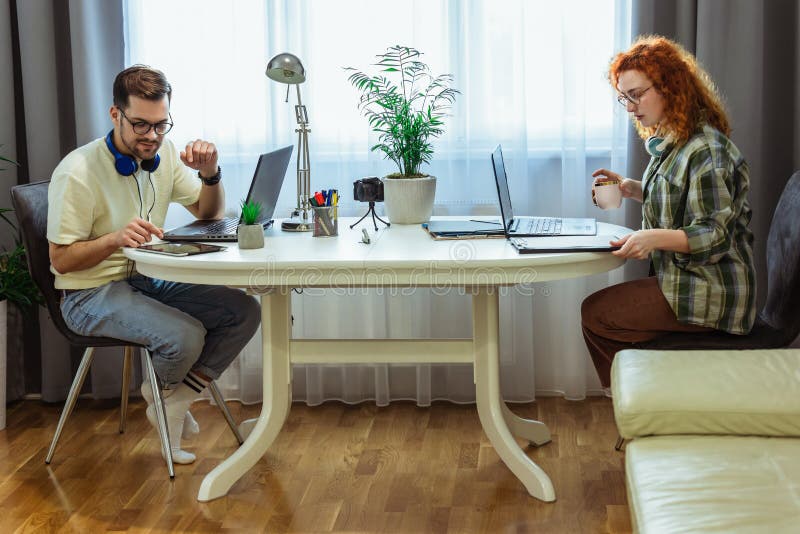 Millennial Couple Working at Home. Concept of Freelance and Remote Work ...