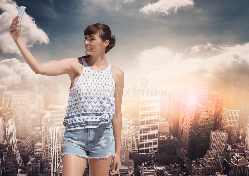 Millennial Girl In Summer Clothes Taking Selfie Against Light Blue