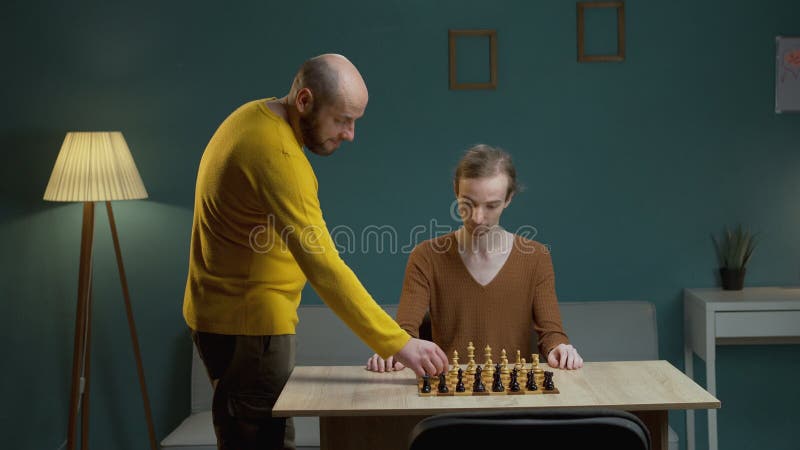 Millennial Man Teaching Young Guy Playing Chess Explaining Rules of ...