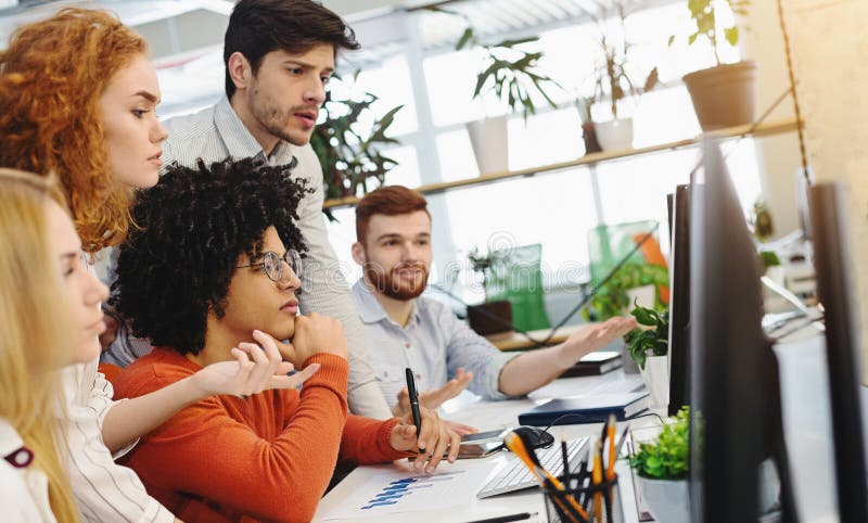 Millennial Team Working with New Project on Computer Screen Stock Photo ...