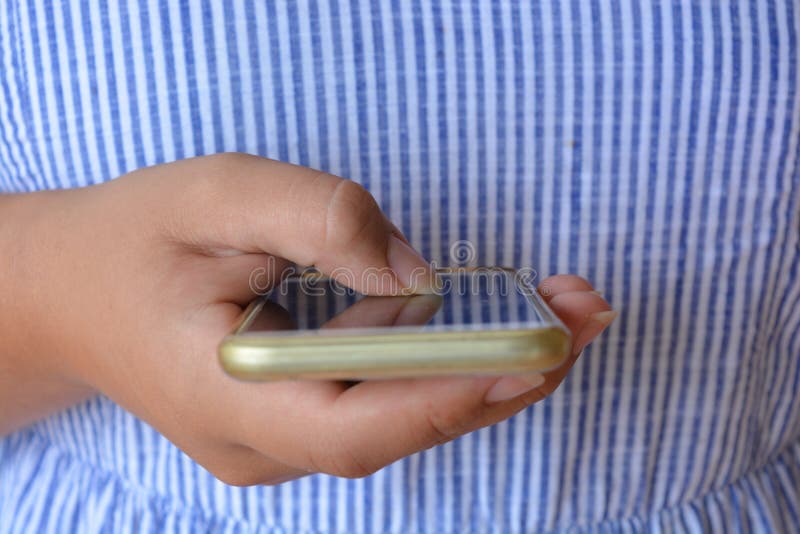Millennial Woman Using a Smartphone, Thumb on Touchscreen Stock Image ...
