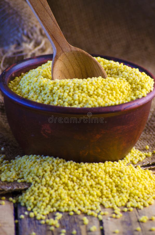 Millet in a bowl stock photo. Image of yellow, crop, seeds - 85943188