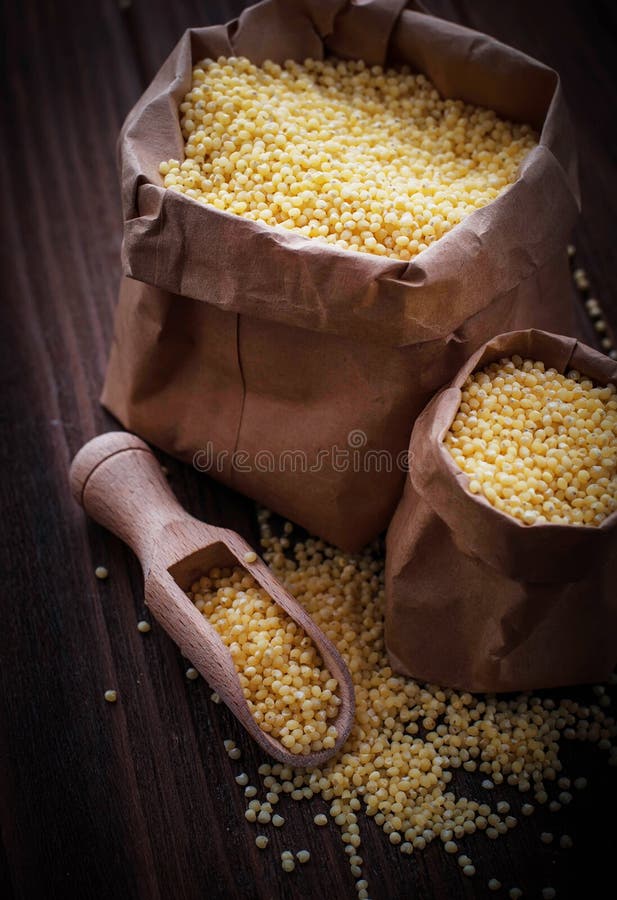 Millet grain in paper bags stock image. Image of color - 67967285