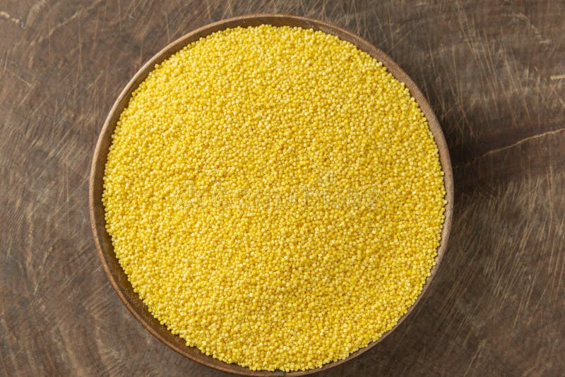 Pile of Golden Millet, a Gluten Free Grain Seed, in Glass Storage Jar ...