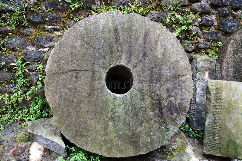 Millstone stock image. Image of greenery, natural, stone - 15680607
