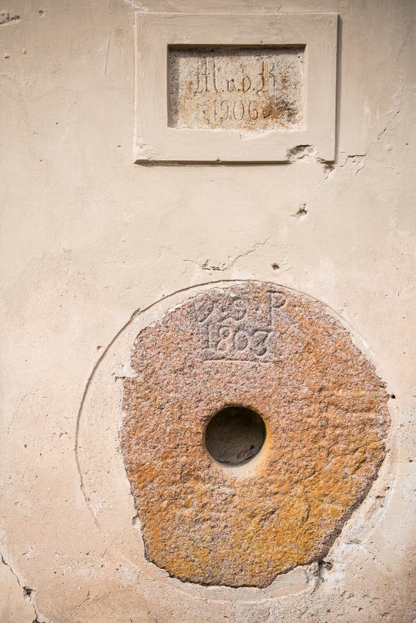 The Millstone and Dates are Built into the Wall of an Abandoned ...