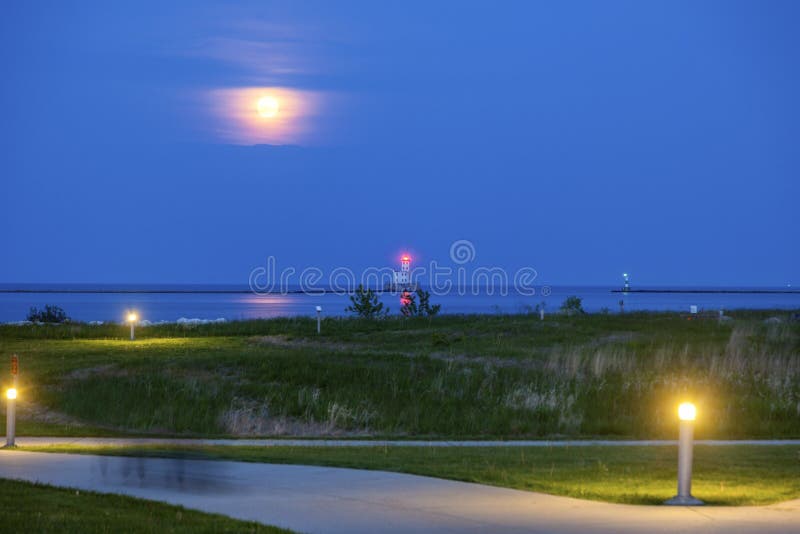 Milwaukee Breakwater Lighthouse and Full Moon Stock Photo - Image of ...
