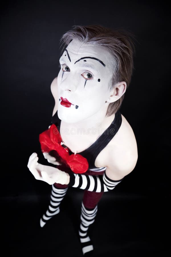 Mime with a Big Red Bow on a Black Background Stock Image - Image of ...