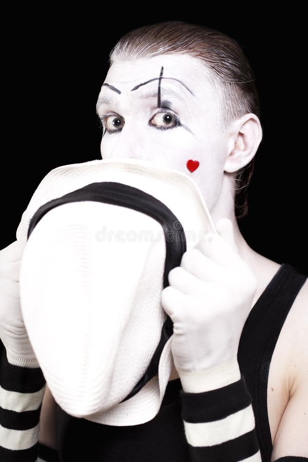 Mime holding white hat stock photo. Image of pantomime - 15826150