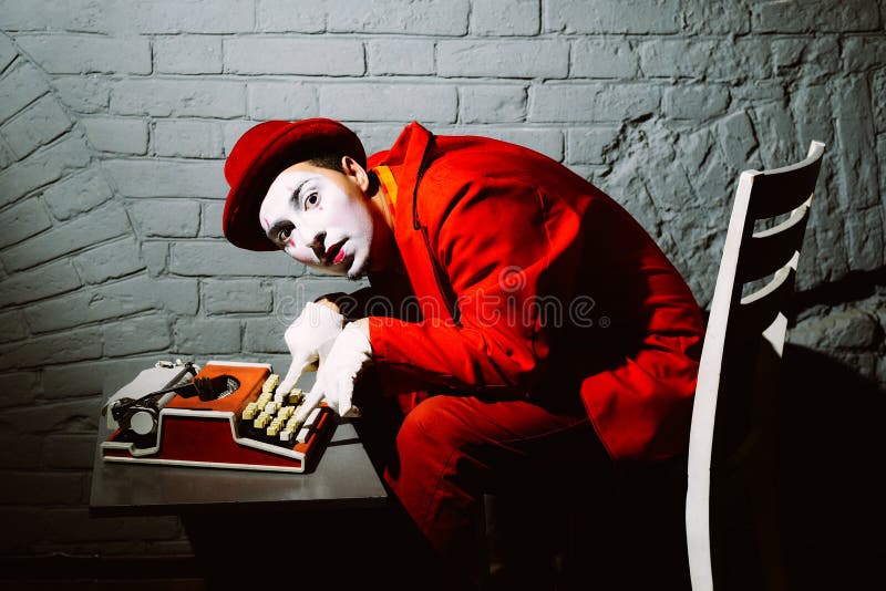 Mime in a Red Suit Prints on a Typewriter Stock Image - Image of ...