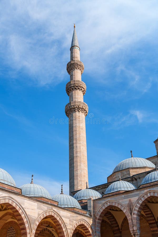 The Minaret of the Mosque Against the Background of a Blue Sky with ...