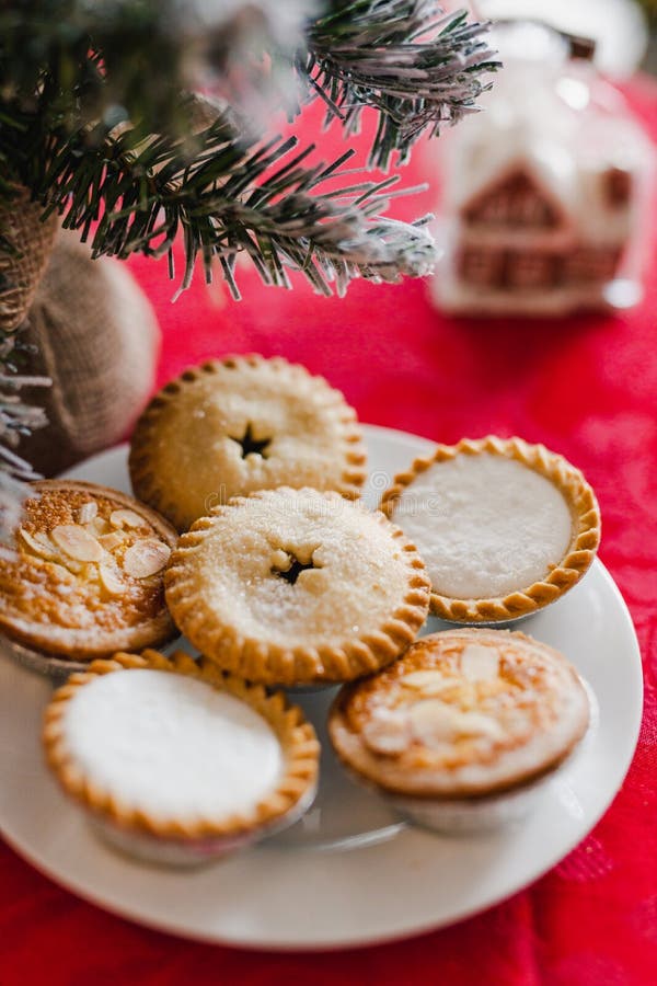 Mince Pies on Christmas Table Setting with Decorations and Tree Stock ...