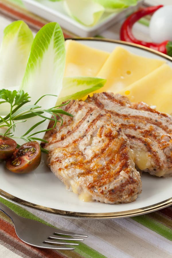 Minced cutlets with cheese stock image. Image of fork - 26950531