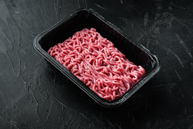 Minced Meat in Packaging, on Black Stone Background Stock Photo - Image ...