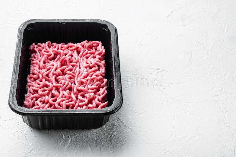 Minced Meat in Packaging, on White Stone Background, with Copy Space ...