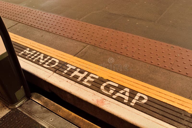 Mind the Gap Sign on Underground Platform. Stock Photo - Image of ...