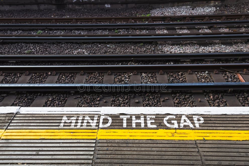 Mind the Gap Sign on a Train Platform Warning Passengers To Be Cautious ...