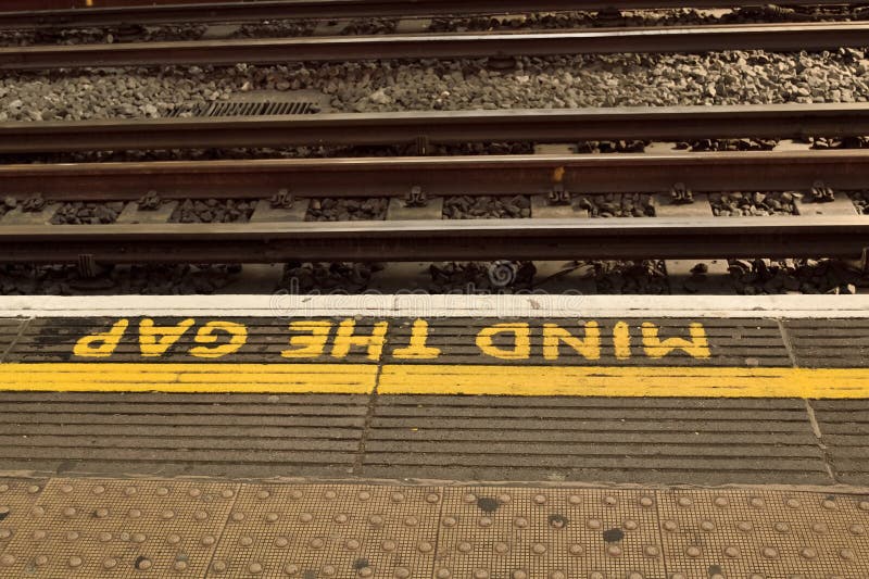 Mind the Gap Sign on Underground Platform. Stock Photo - Image of ...
