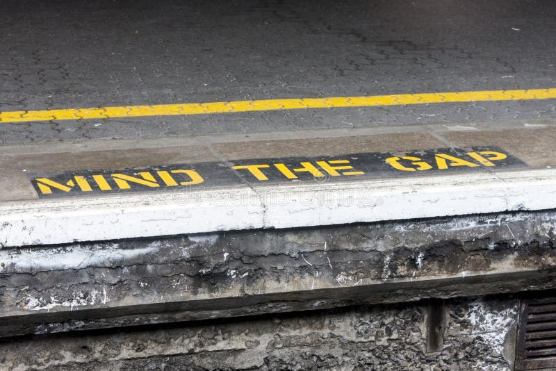 Mind the gap warning sign stock photo. Image of transportation - 116962368