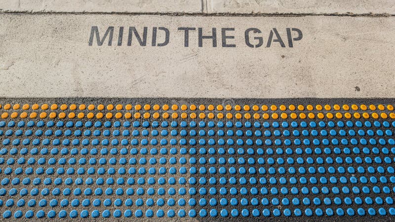 Mind the Gap Warning Sign on the Floor. Stock Photo - Image of pattern ...