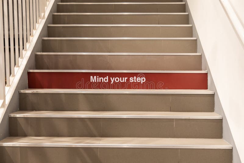 Mind Your Step Precaution Message Printed on Step on Staircase Stock ...
