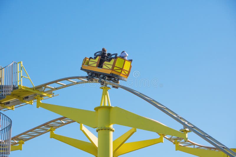 Minecart Goes Up the Yellow Roller Coaster Rails Stock Image - Image of ...