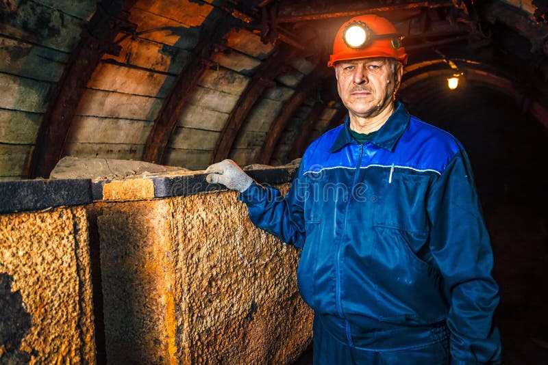 A Miner in a Coal Mine Stands Near a Trolley. Copy Space Stock Image ...