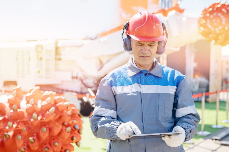 Miner Operator in Helmet Control Drilling Machine in Coal Mine. Concept ...