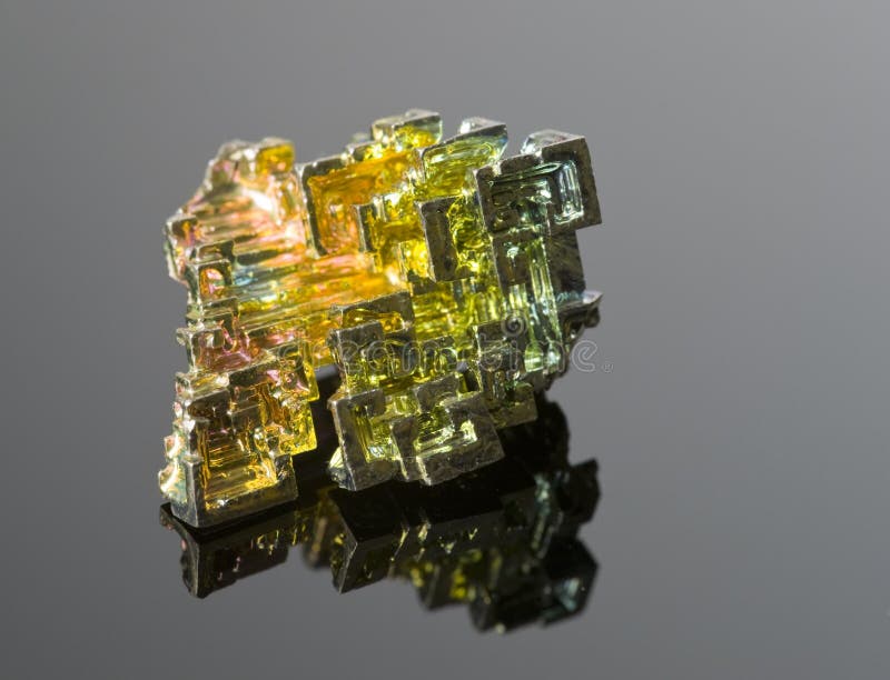 The Mineral Bismuth on a Black Reflective Surface Stock Photo - Image ...