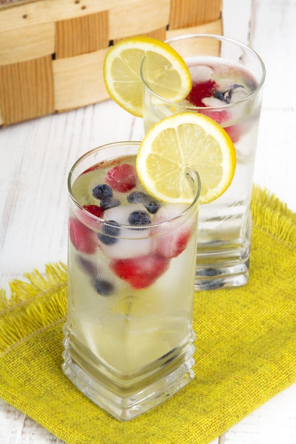 Mineral Water with Fruit Frozen in Ice Cubes Stock Photo - Image of ...