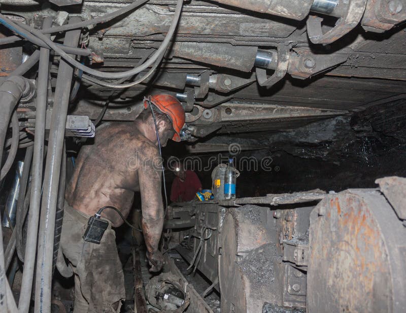 Miners Near a Coal-plow Machine in the Underground Workings Editorial ...