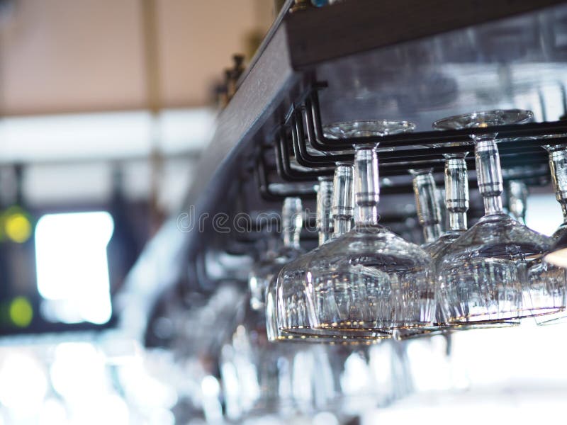 Closeup Mini Bar Glass Hanging on Iron Rail. Stock Image - Image of ...