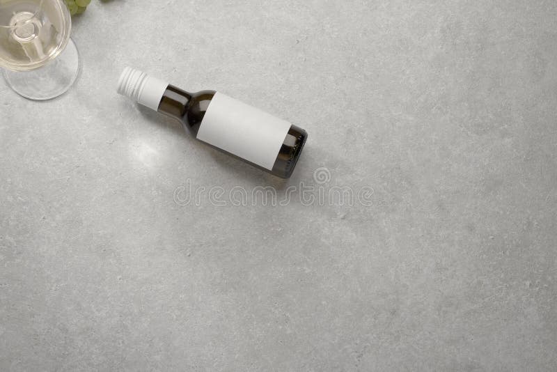 Mini Bottle of White Wine with a Label, Grapes and a Cork. Wine Bottle ...