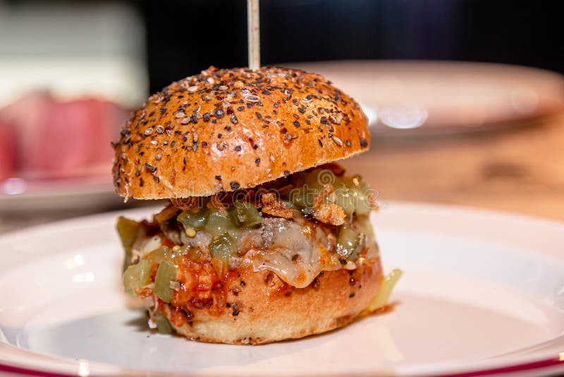 Mini Burger with Beef, Pickled Cucumber and Onion is on a Plate Stock ...