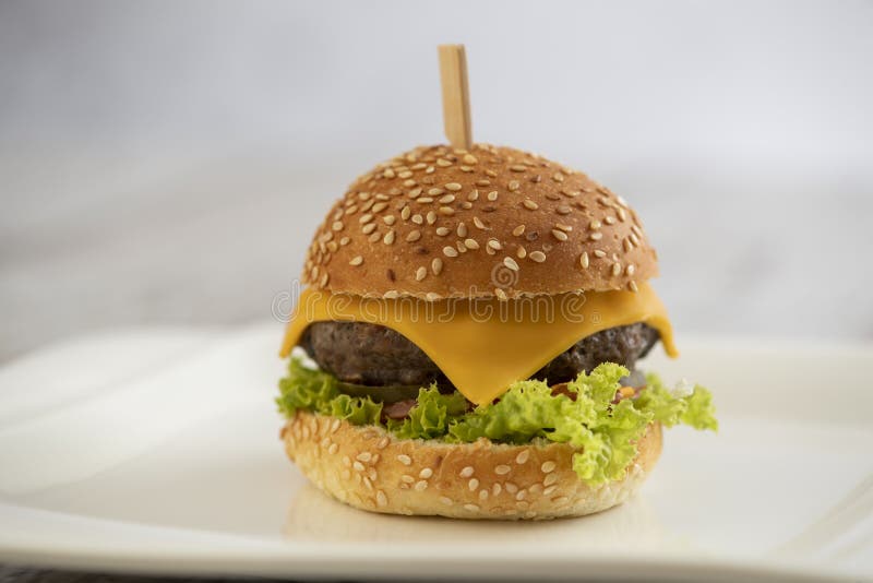 Mini Burger with Cheese and Lettuce with Sticks Stock Photo - Image of ...