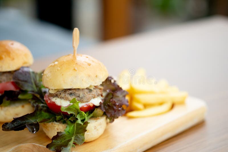 Mini Burgers Served for Dinner on Wood Plate Stock Image - Image of ...