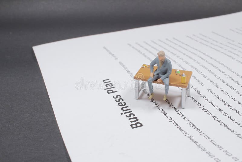 A Mini of Business Figure on the Business Plan Paper Stock Image ...
