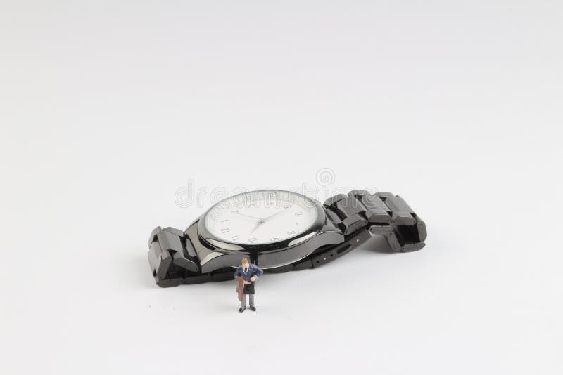 Mini Business Man Figure Standing on Watch Stock Photo - Image of ...